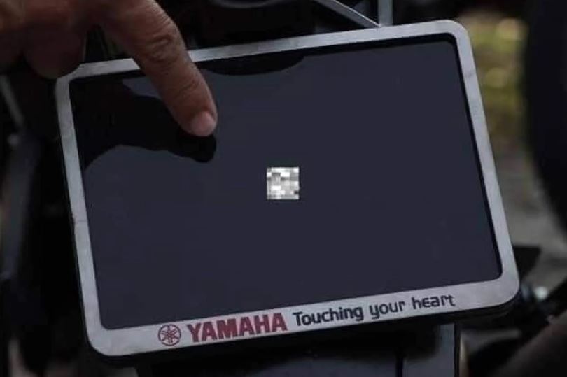 Malaysian biker caught with ‘world’s smallest number plate’– tiny as a ...